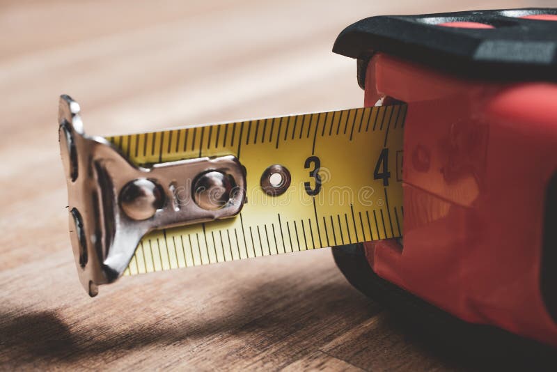 Macro of a Solid Measuring Tape with Pulled Out Scale Lying on a Table ...