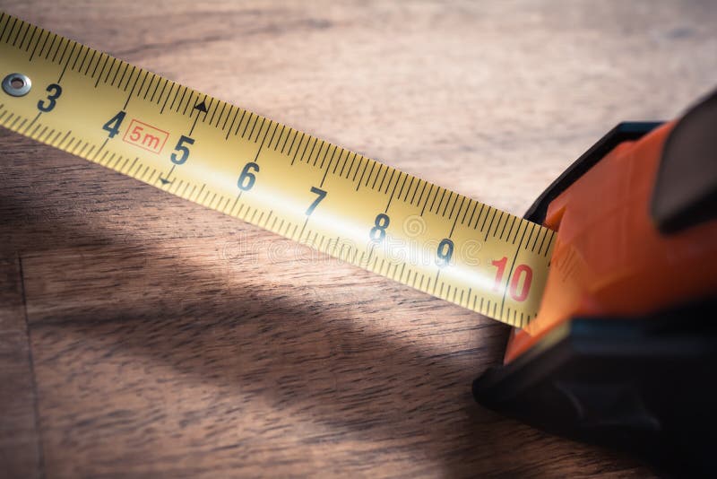 Solid Measuring Tape with Pulled Out Scale Lying at Right Side of a ...