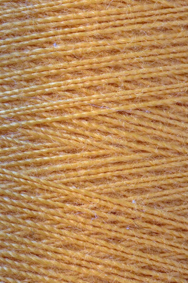 The Macro Texture of Orange Cotton Thread on Bobbin. Stock Image ...