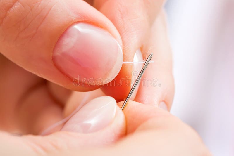 Macro of Threading a Needle Stock Image - Image of nailed, finger: 56120759