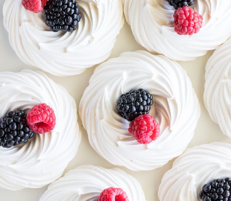 A Macro Top Down View of Bright White Meringues Topped with Berries ...