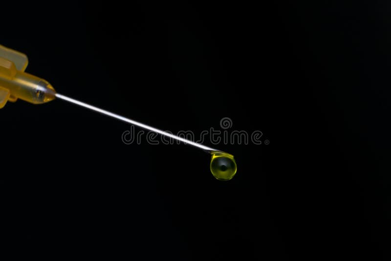 Macro View of a Hypodermic Needle with Two Drops of Drug Solution on ...