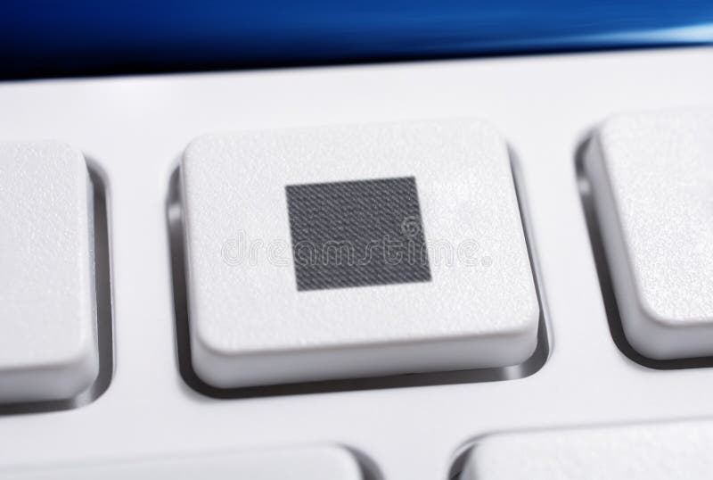 Macro of a White Stop Button of a White Remote Control for a Hifi ...