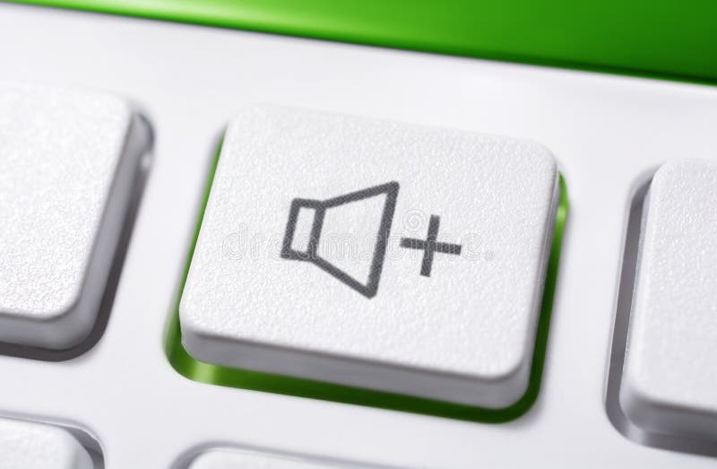 Macro of a White Volume Up Button of a White Remote Control for a Hifi ...