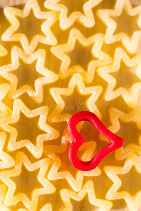 Macrophotography of a Red Heart on the Background of Curly Pasta Stock ...