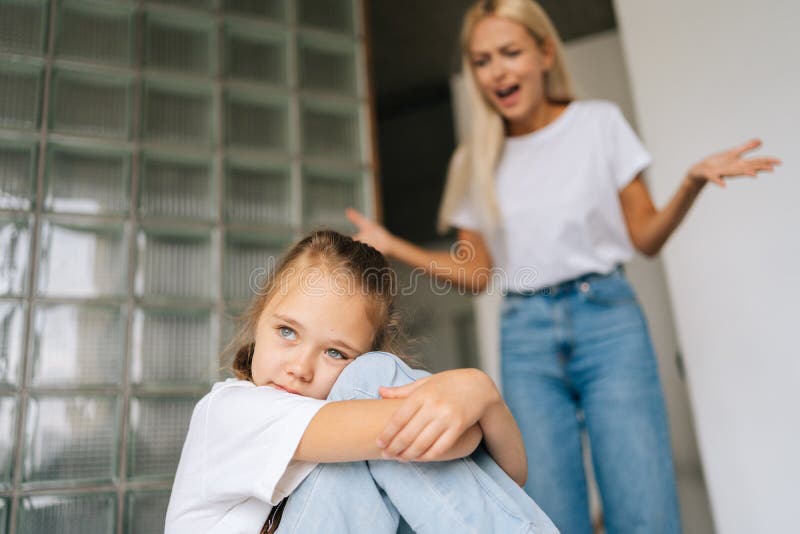 Mad Blonde Abusive Mother Emotionally Gesturing And Shouting At Crying