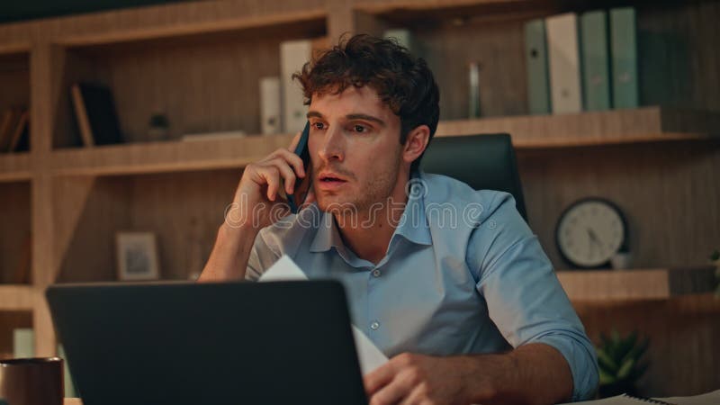 Mad Executive Calling Smartphone Holding Documents at Night Workplace ...