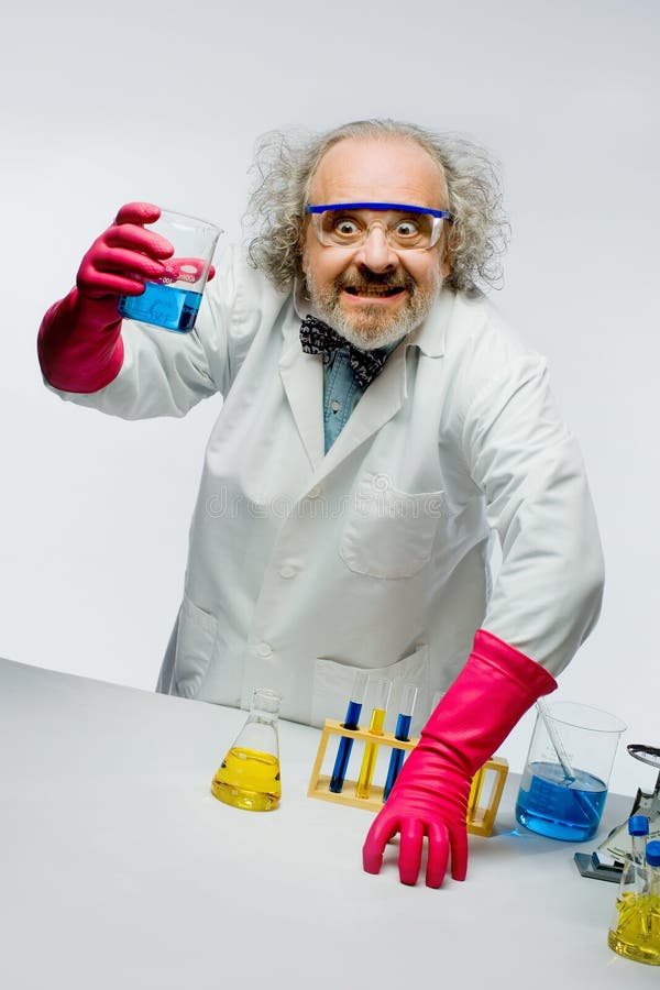 Mad Scientist Holding a Beaker with Blue Liquid Stock Photo - Image of ...