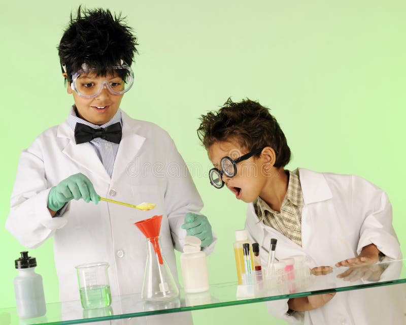 Smiling Boy Conducting Experiment In Chemistry Lab Stock Photo - Image ...