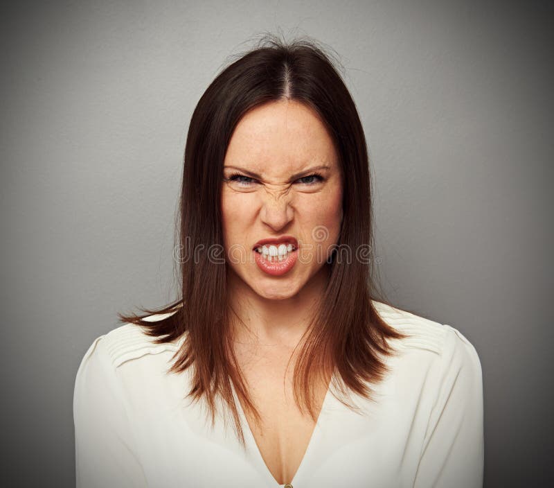 Mad woman baring her teeth stock image. Image of female - 30960629