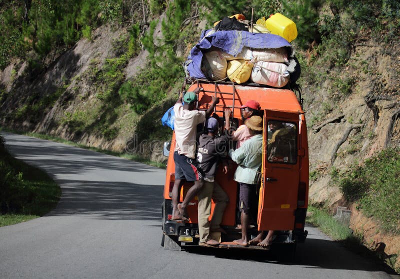 Overloaded Bus Moves through the Vastness of the Island of Madagascar ...