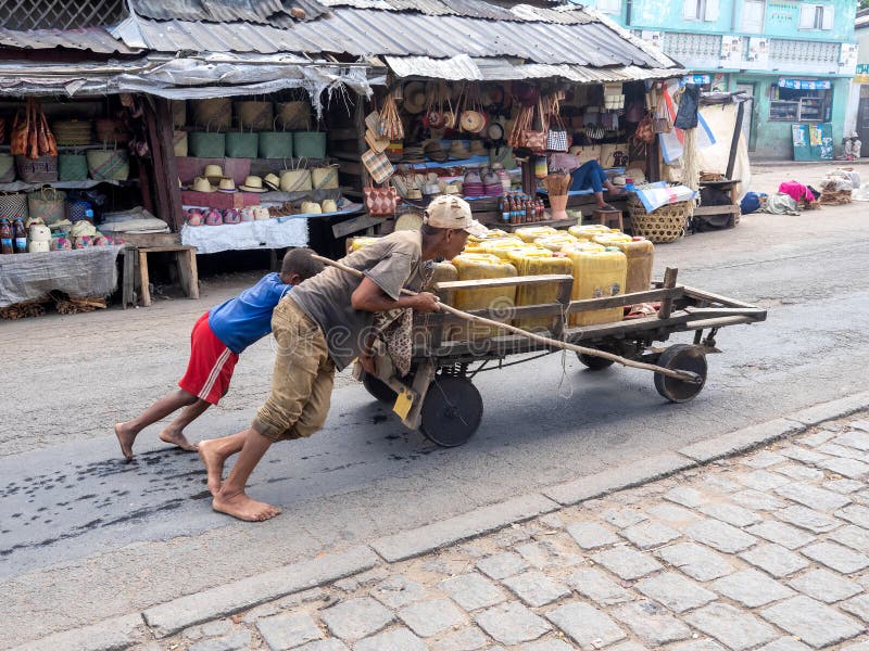 : Hard Work Pushing a Cart. November 25, 2022 Madagascar Editorial ...