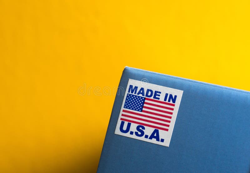Made in U.S.a. Emblem on Blue Package Over Yellow Background Stock ...