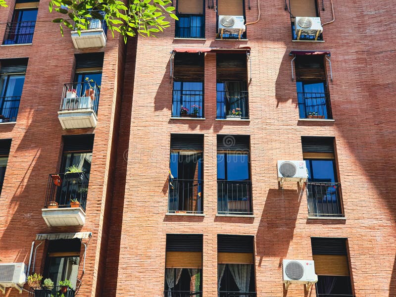 Madrid, Sp Low Angle View of a Red Bricks Building Facade with Windows ...