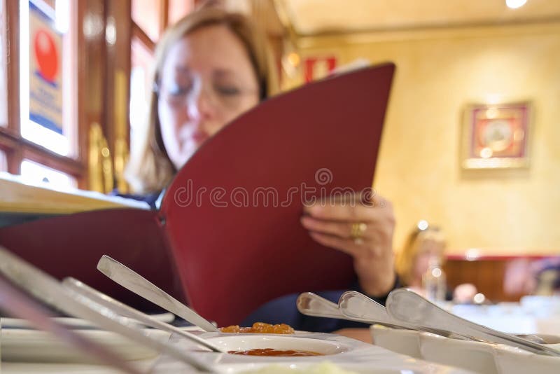 MADRID SPAIN - October 29, 2023: Unrecognizable Person Reading Menu in ...