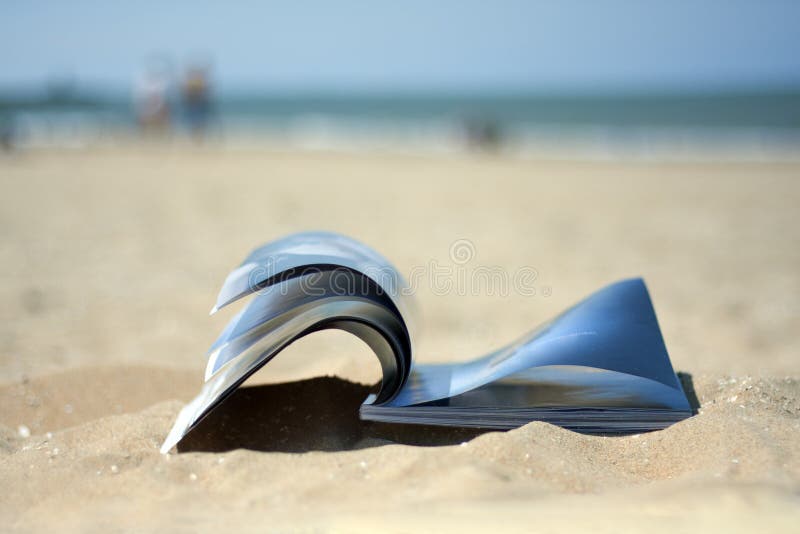 Magazine on the beach stock image. Image of sand, landscape - 20485749