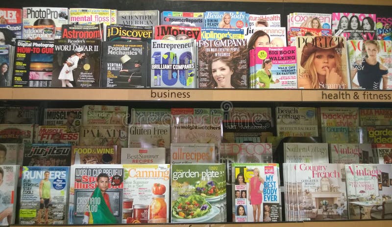 Magazines on shelves editorial stock image. Image of close - 41397329