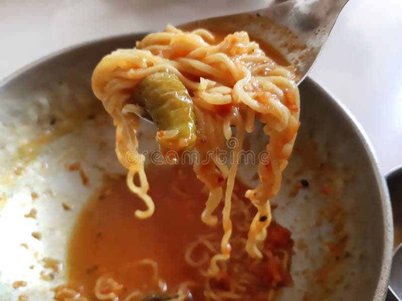 Maggi is Wrapped in a Spoon in a Steel Bowl. Stock Photo - Image of ...