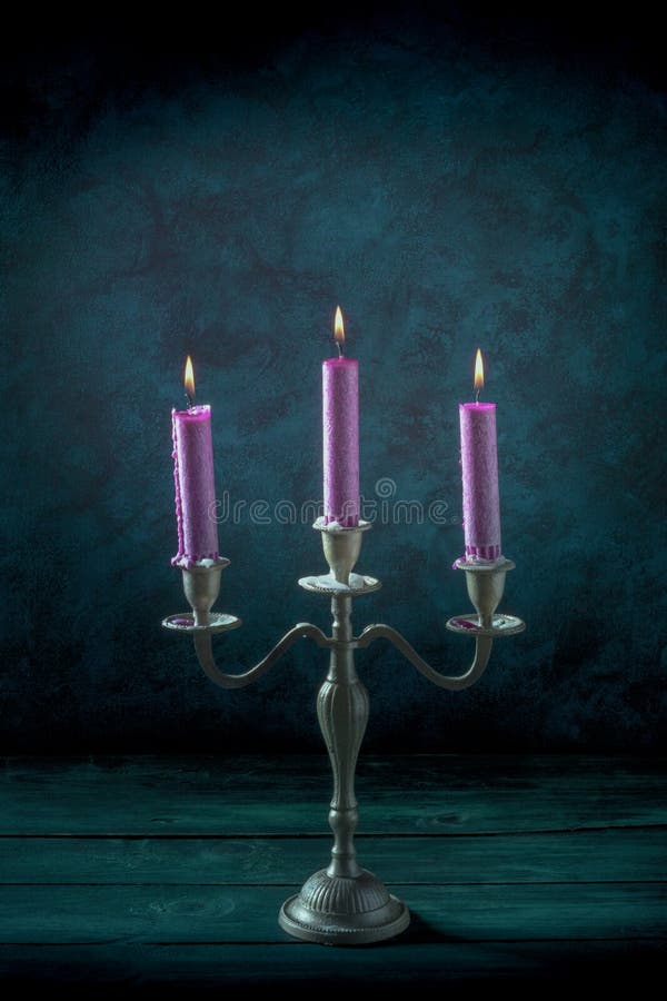 Magic Candles in a Vintage Candle Holder, Side View on a Dark ...
