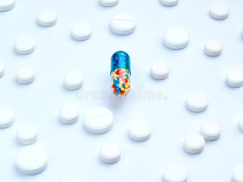 Magic Pill Concept. a Large Tablet Capsule with Multi-colored Filling ...