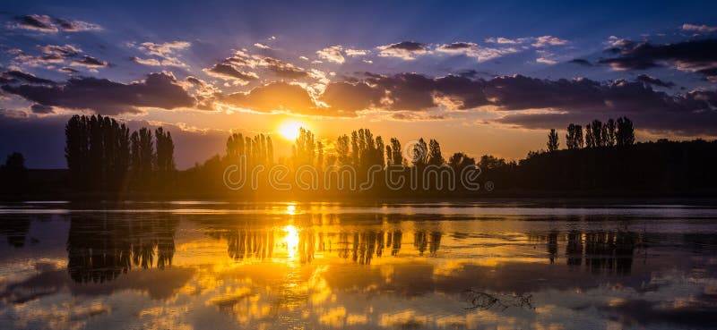 Magic sunrise stock photo. Image of lake, field, cloud - 99575600