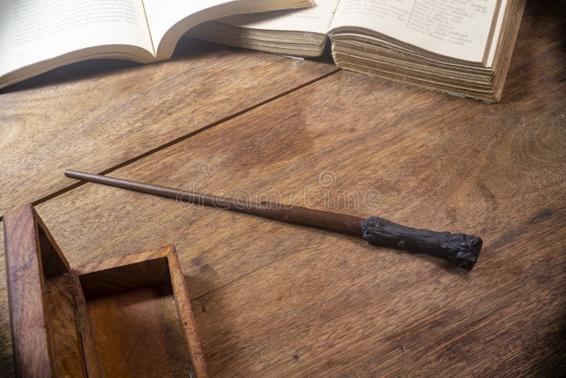 Magic Wand on a Wooden Table with an Open Book Stock Photo - Image of ...