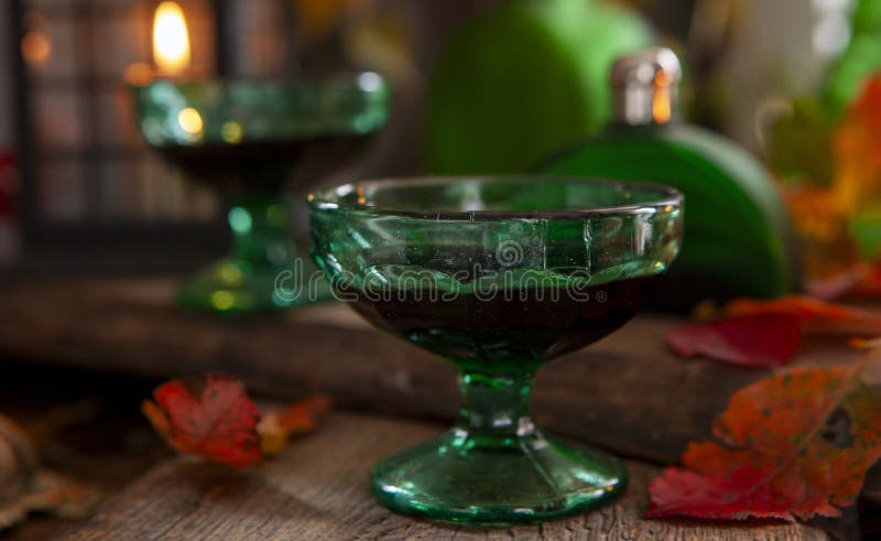 Magic Wine in a Green Glass and Autumn Leaves Stock Photo - Image of ...