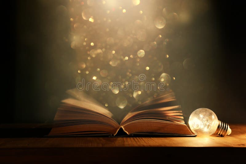 Magical Image of Open Antique Book Over Wooden Table with Glitter ...