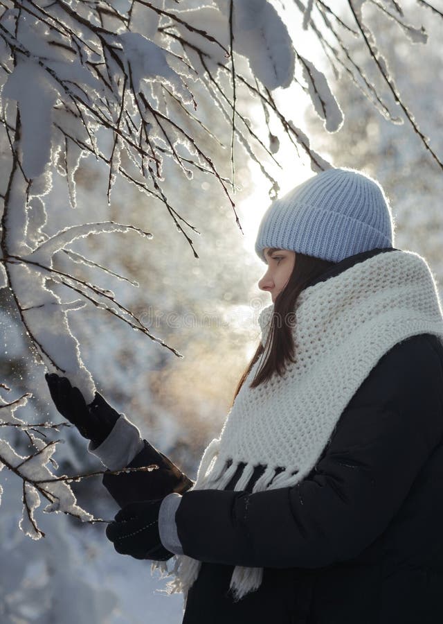 Magical Portrait of a Woman Touching Snow on Trees with Copy Space ...
