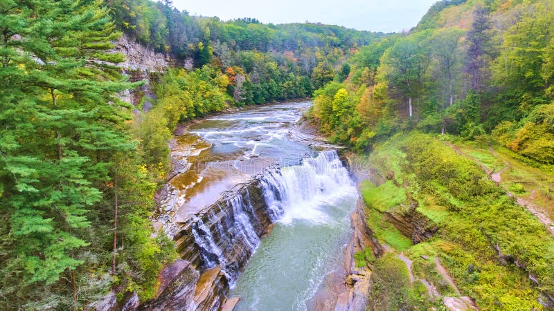 Magical Waterfall Hidden in Woods Eroding Cliffs with Fall Foliage ...