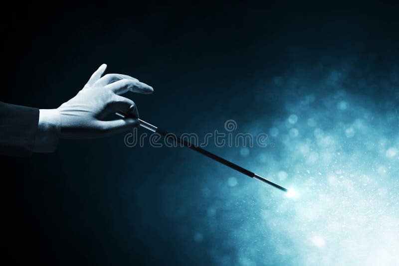 Magician Hand Holding Magic Wand on Dark Backgrounds Stock Image ...