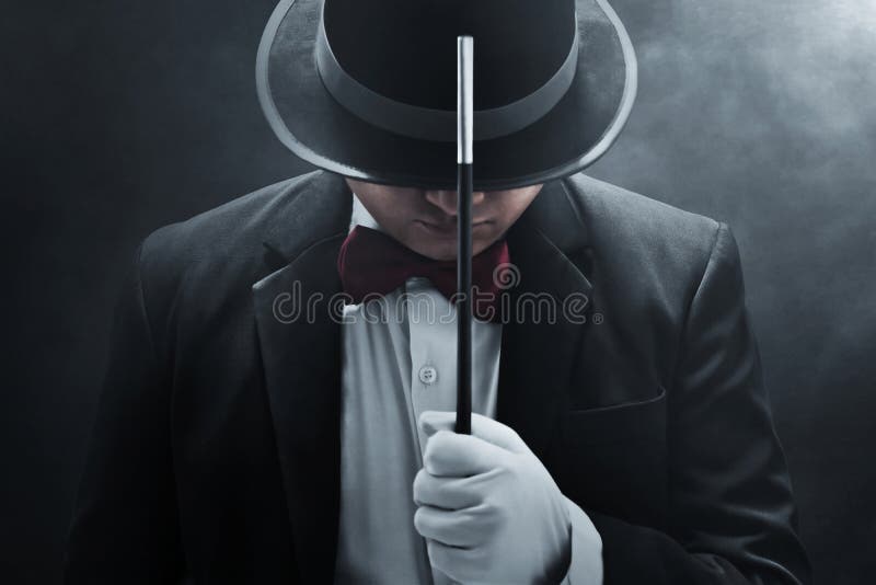 Magician Holding Magic Wand on Dark Backgrounds Stock Image - Image of ...