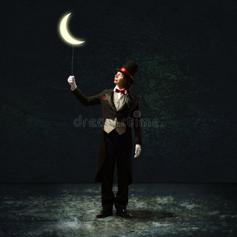 Magician Keeps the Moon on a String Stock Image - Image of blue, glow ...