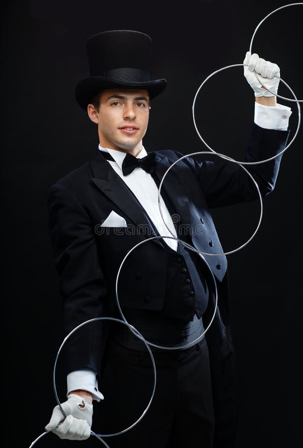 Magician Showing Trick with Linking Rings Stock Photo - Image of ...