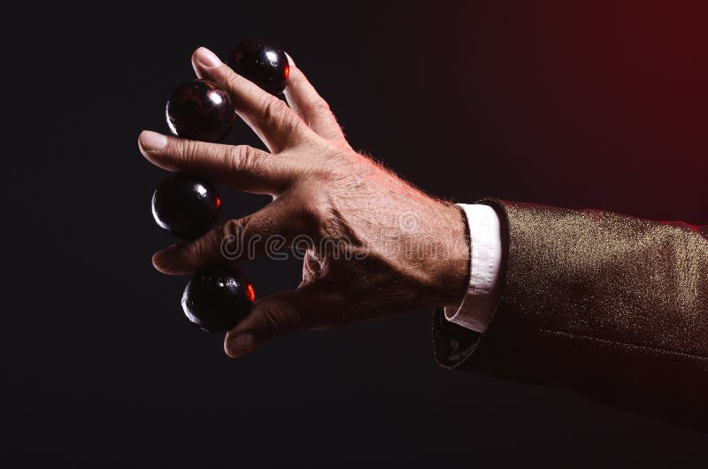 Magician Shows Trick With Magic Balls. Manipulation With Props. Stock ...