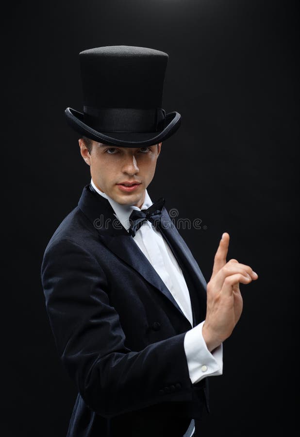 Magician in Top Hat Showing Trick Stock Photo - Image of black, dark ...