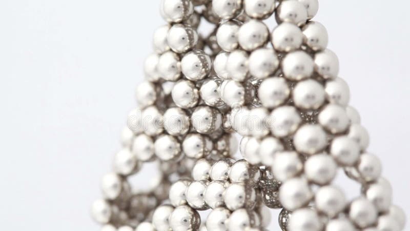 Magnet Balls in Triangular Structure with Holes, Stock Video - Video of ...