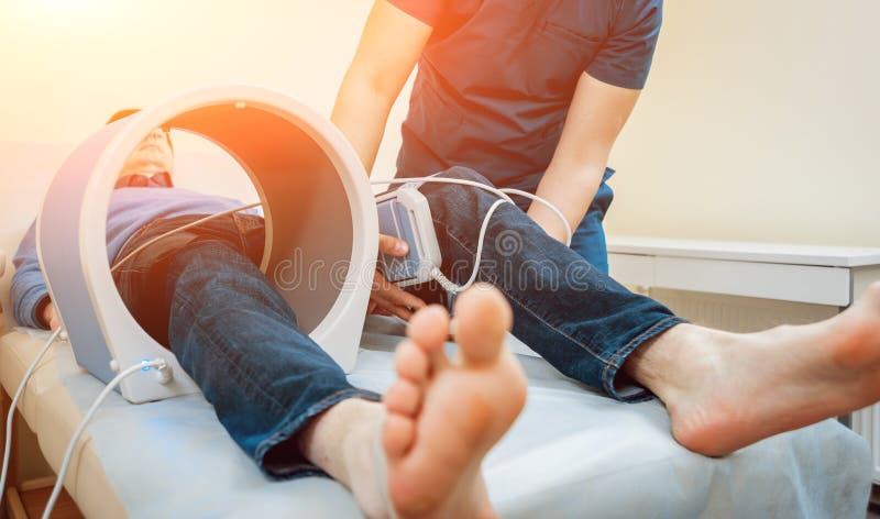 Magnet Therapy System. Patient with Doctor in Office. Stock Image ...