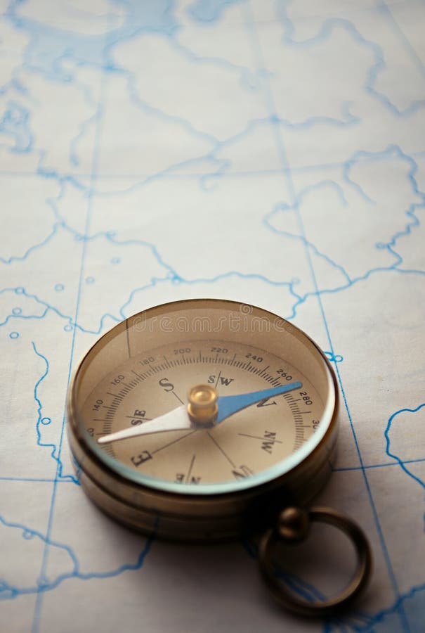 Magnetic Compass Lying on a Map Stock Photo - Image of directional ...