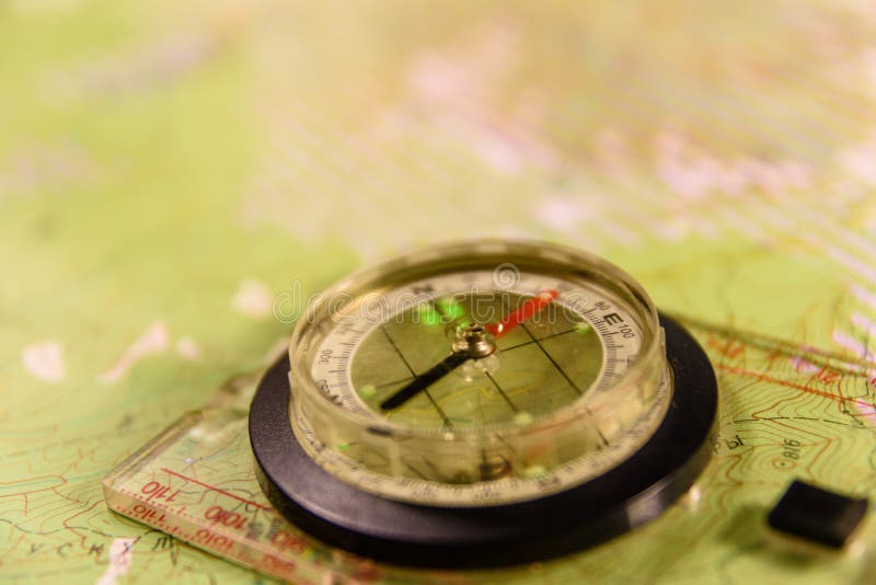 Magnetic Compass Lying on Topographical Map Stock Image - Image of ...