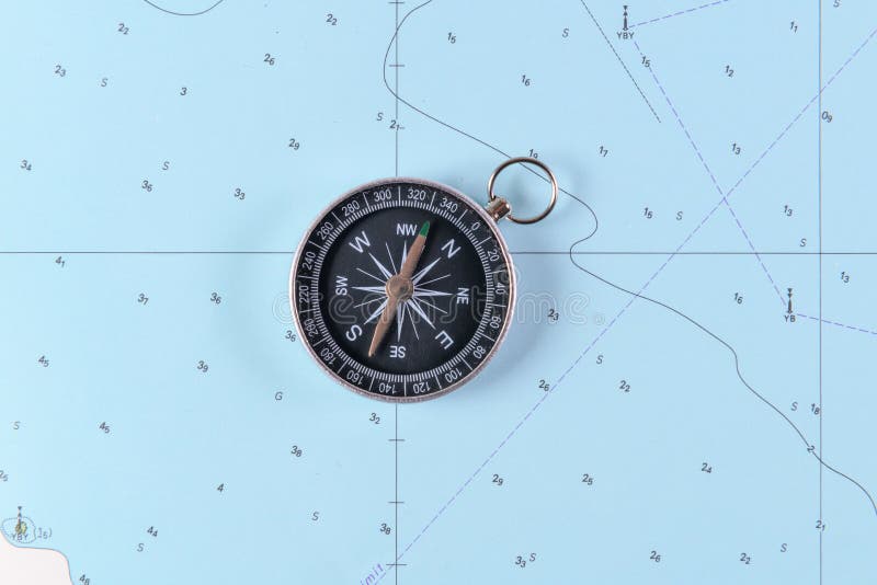 An Old Geographic Map with Navigational Tools: Compass, Divider, Ruler ...