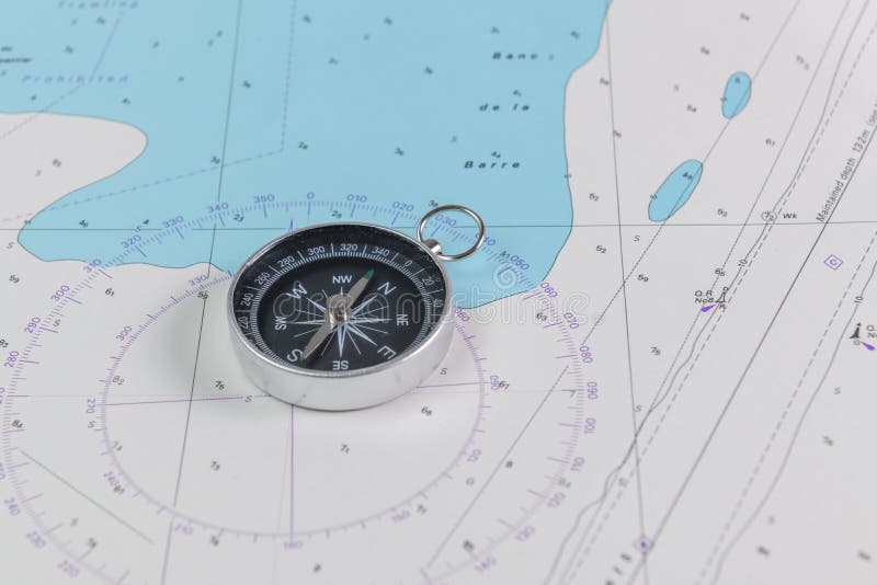 An Old Geographic Map with Navigational Tools: Compass, Divider, Ruler ...