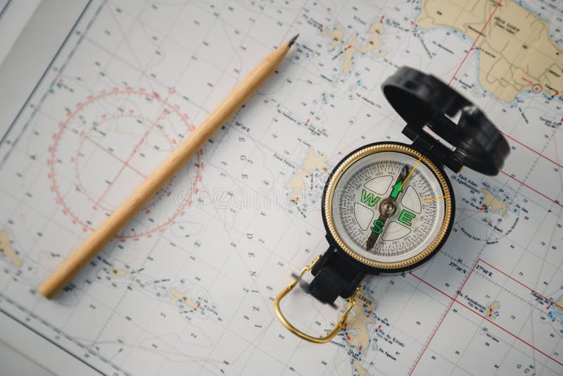Magnetic Compass and Pencil Lying on Map with Rope. Top View Stock ...