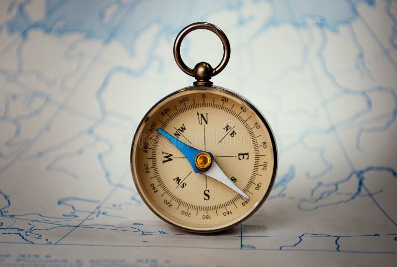 Magnetic Compass Standing Upright on a Map Stock Image - Image of west ...