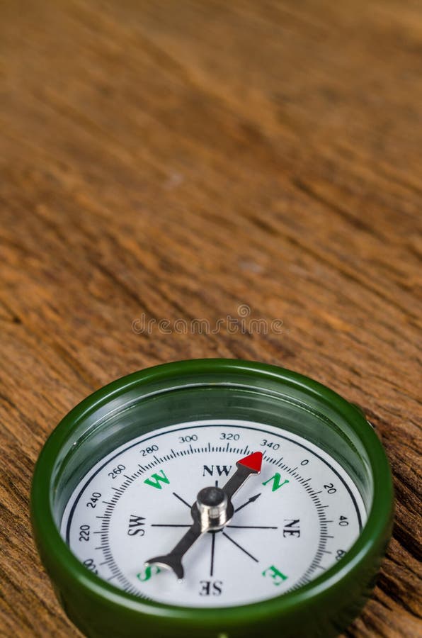Magnetic Compass on Wooden Board Stock Photo - Image of exploration ...