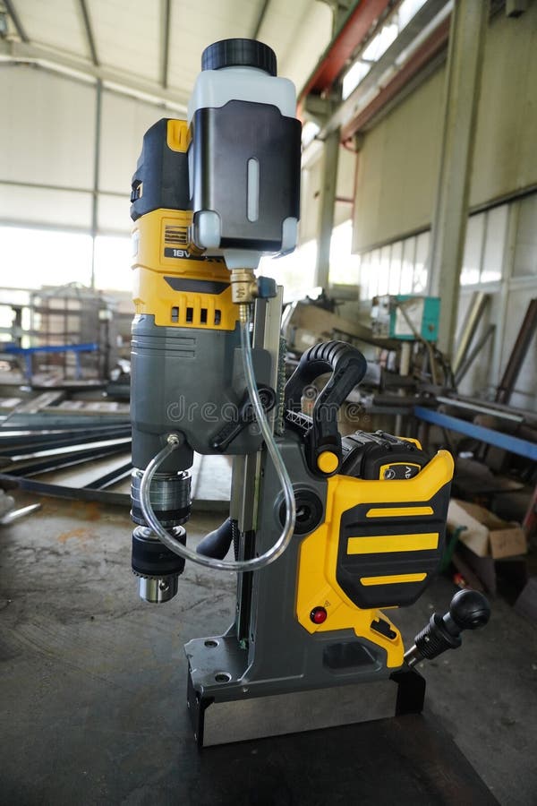 Magnetic Industrial Drill. for Drilling a Hole in a Metal Sheet. Using ...