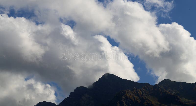 Magnificent Mountains and Clouds on a Sunny Day Stock Photo - Image of ...