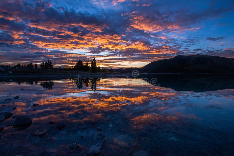 The Magnificent Sunset Reflection Stock Photo - Image of colorful, lake ...