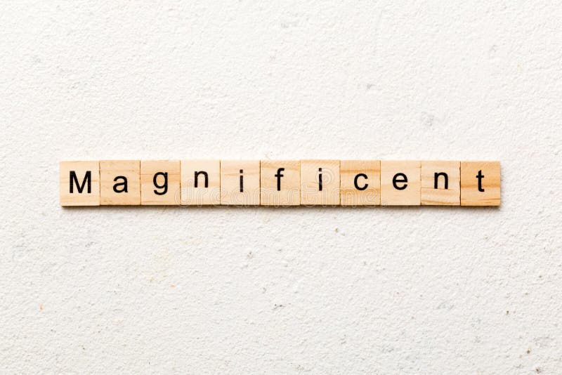 Magnificent Word Written on Wood Block. Magnificent Text on Table ...