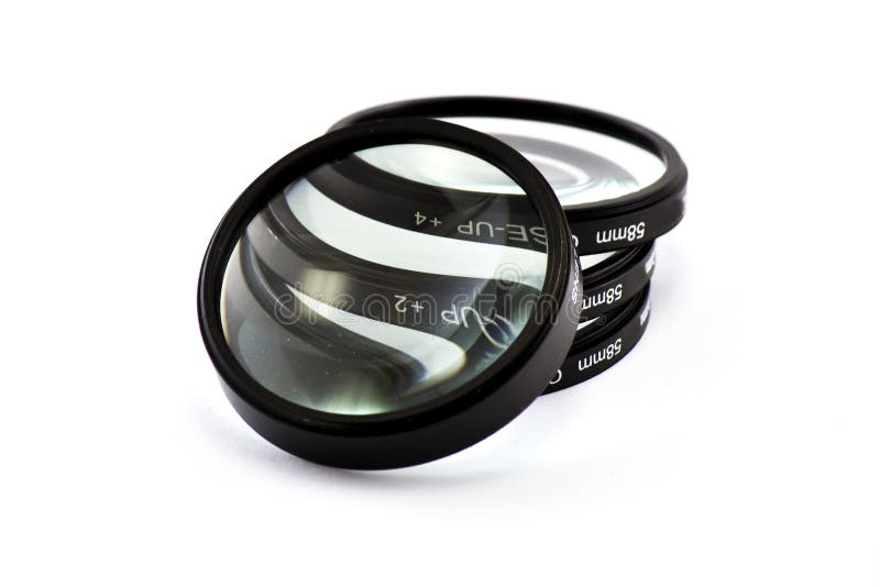 Magnified lenses in white stock photo. Image of black - 17444426